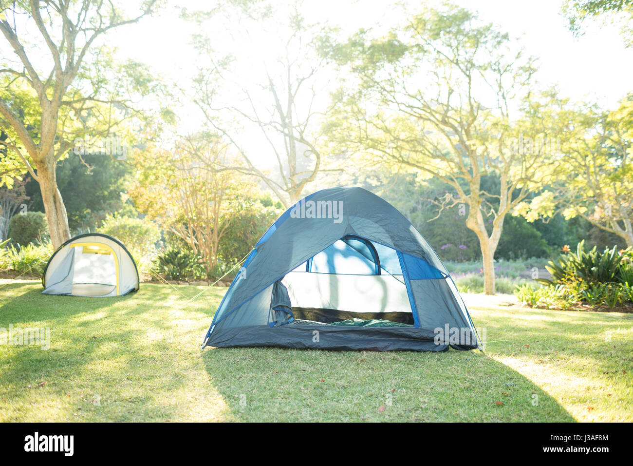 Two tents at campsite on a sunny day Stock Photo - Alamy