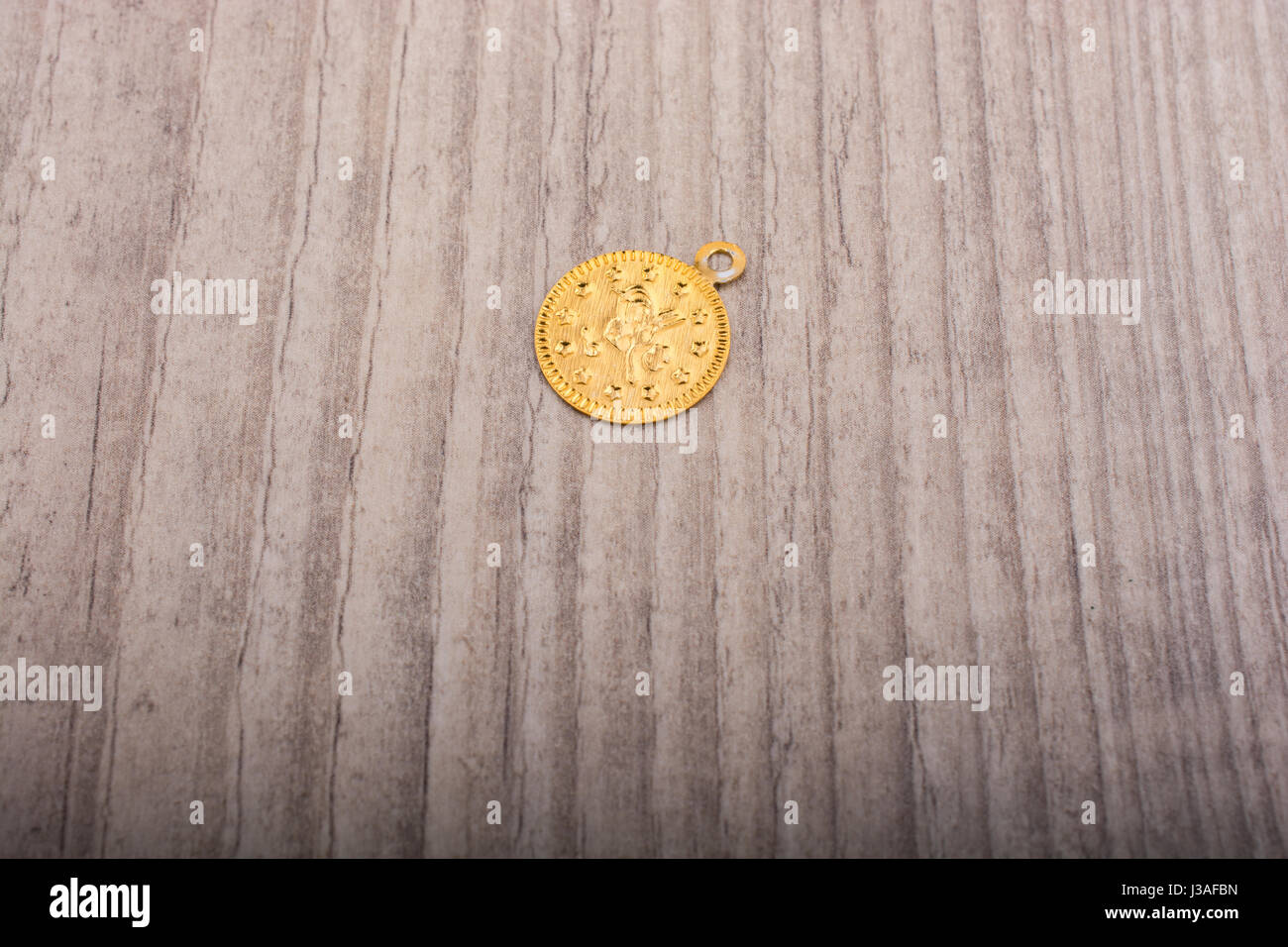 Fake gold coin placed gray background Stock Photo - Alamy