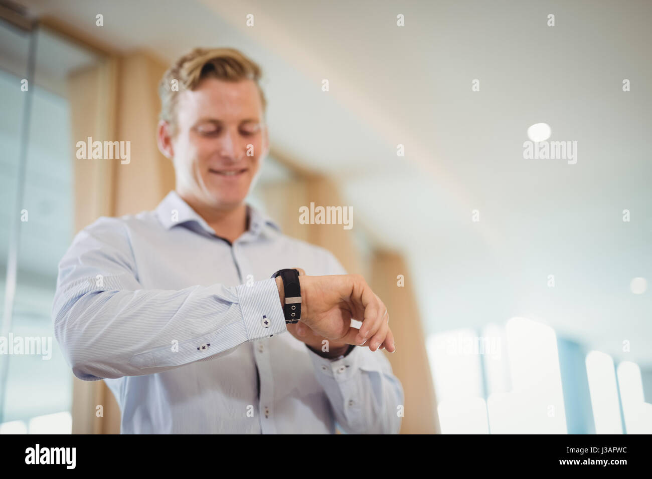 Focused man checking time hi-res stock photography and images - Alamy