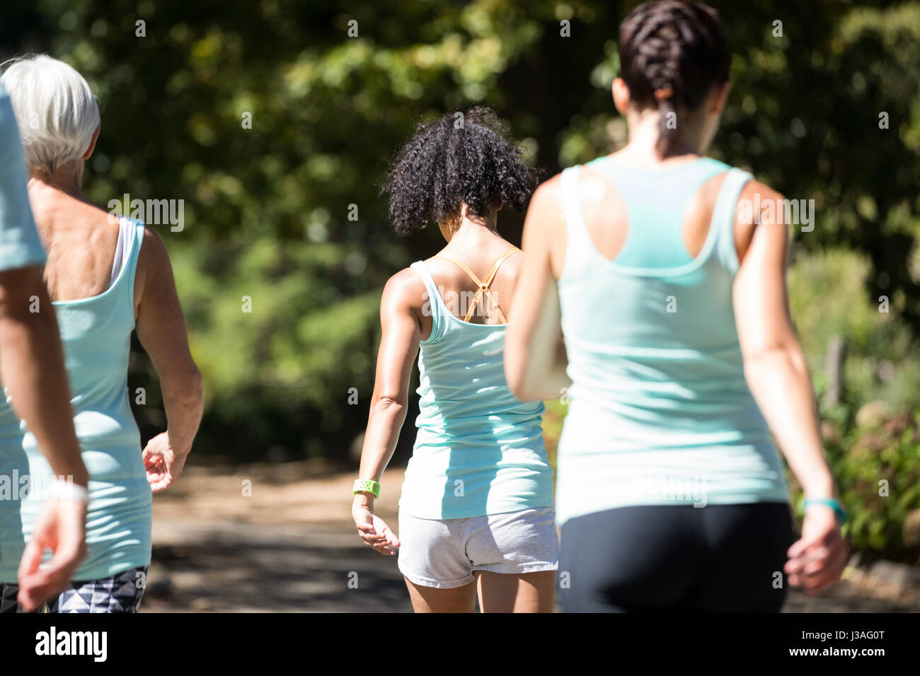 Rear view of marathon athletes walking in the park Stock Photo - Alamy