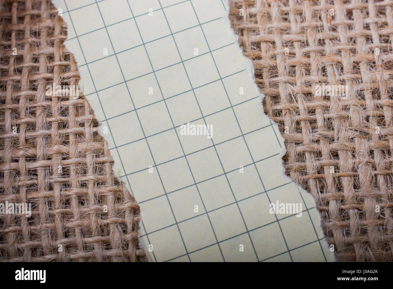 Piece of torn paper placed on a linen canvas Stock Photo - Alamy