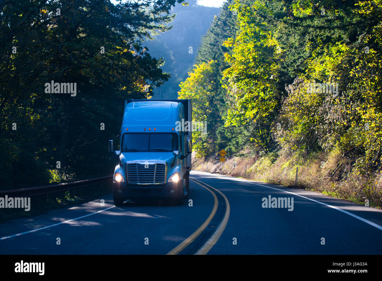 Modern blue American professional powerful big rig semi truck with a ...