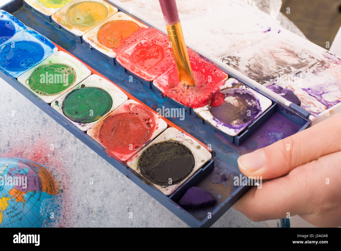 Watercolor paint dissolving in water covered with water Stock Photo - Alamy
