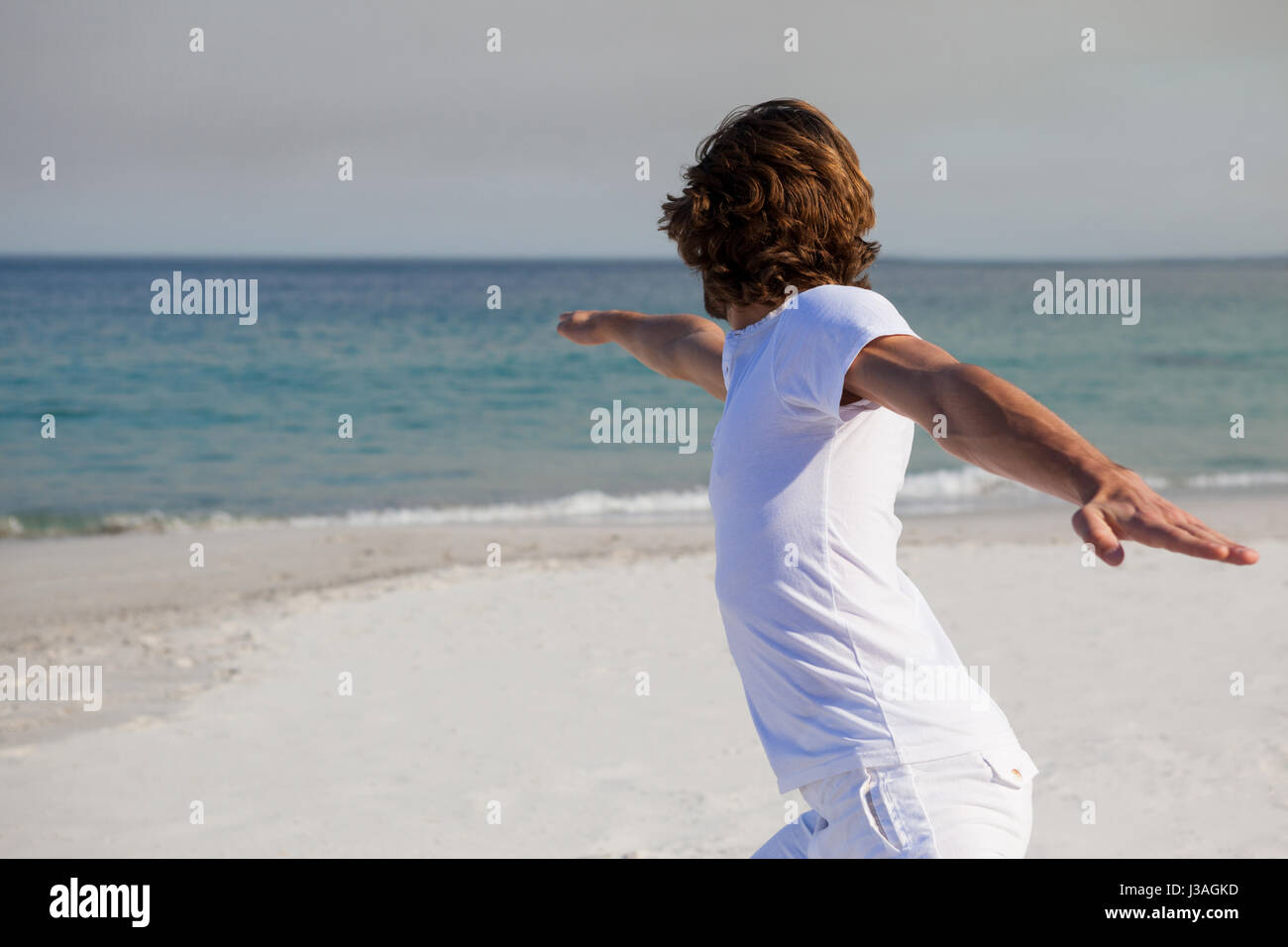 Man standing on beach typing hi-res stock photography and images - Alamy