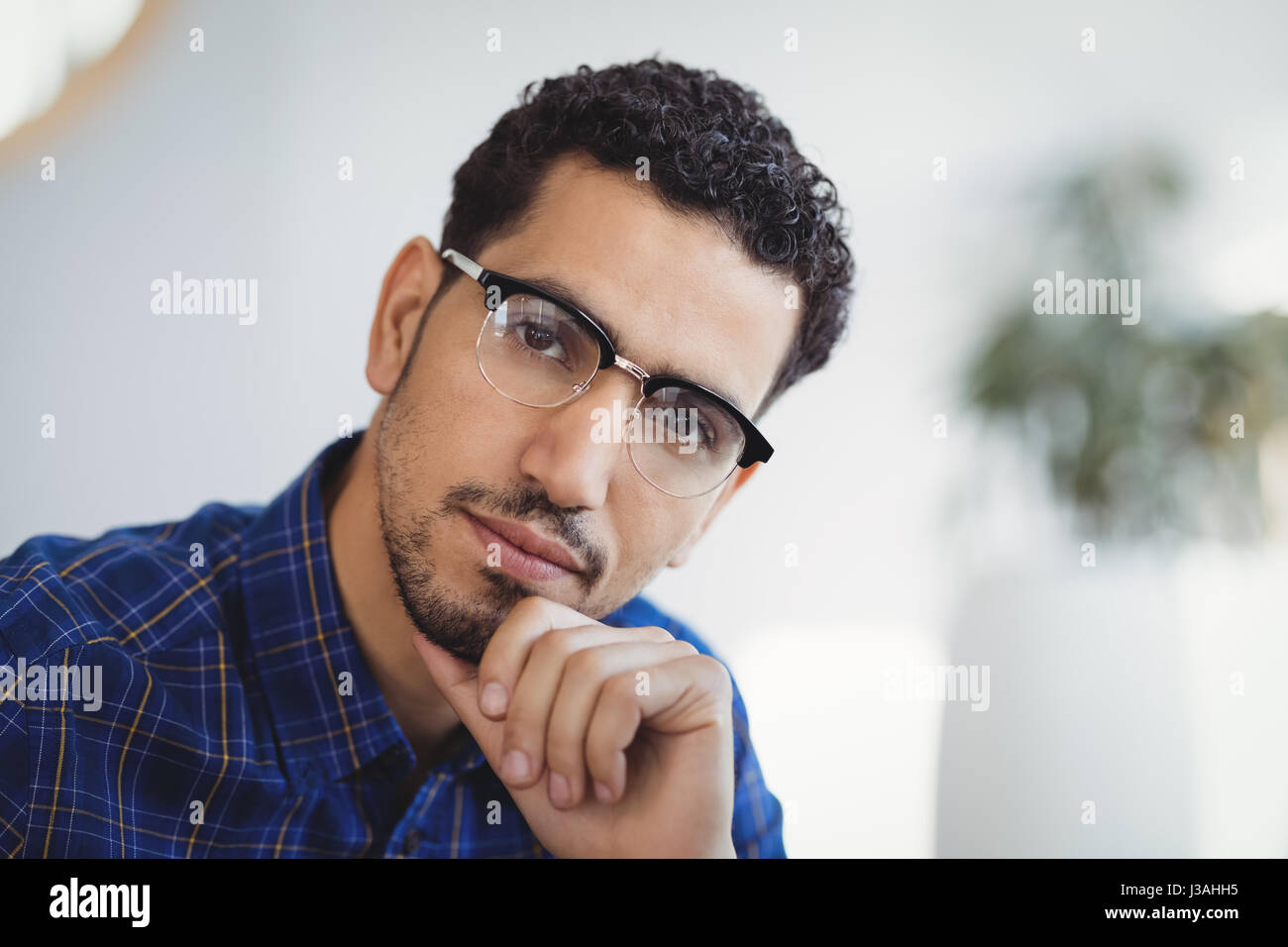 Portrait of smiling executive wearing spectacles in office Stock Photo ...