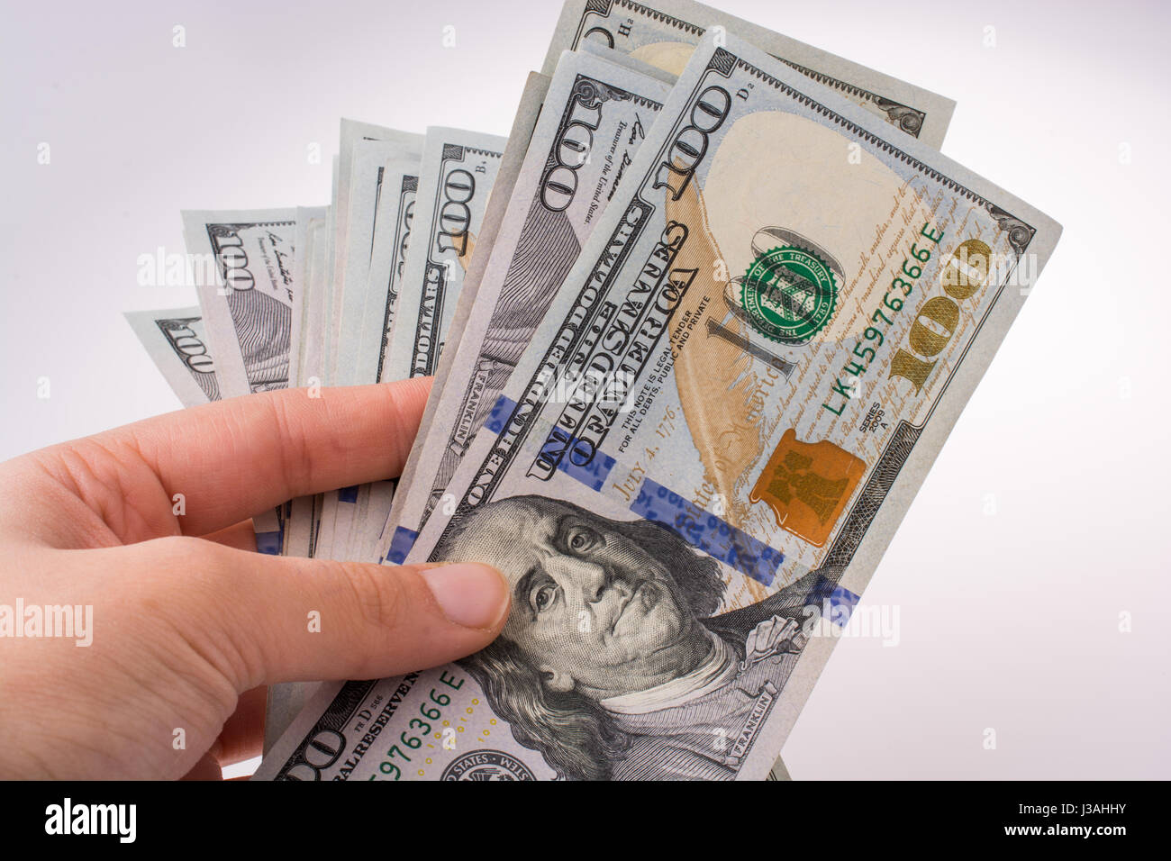 Human hand holding American dollar bill as money isolated on white ...