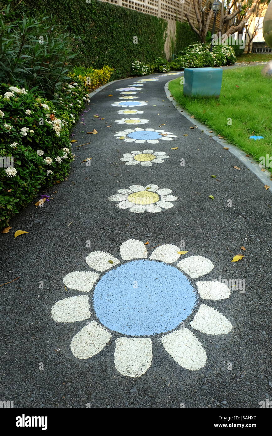 Flower Drawing on Path Way in Public Park Stock Photo - Alamy