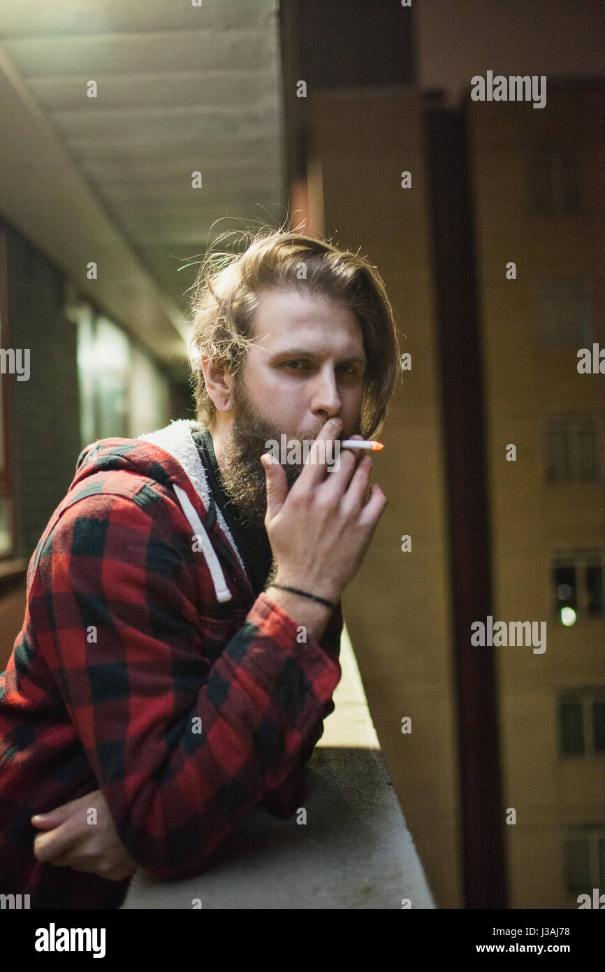 Smoking on a balcony hi-res stock photography and images - Alamy