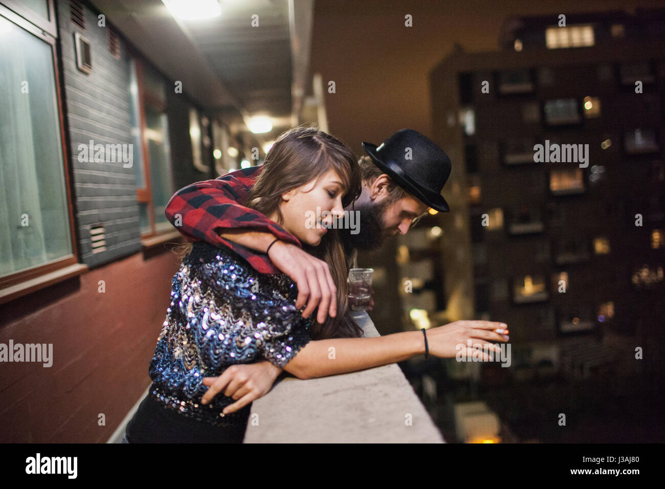 Woman on balcony night hi-res stock photography and images - Alamy