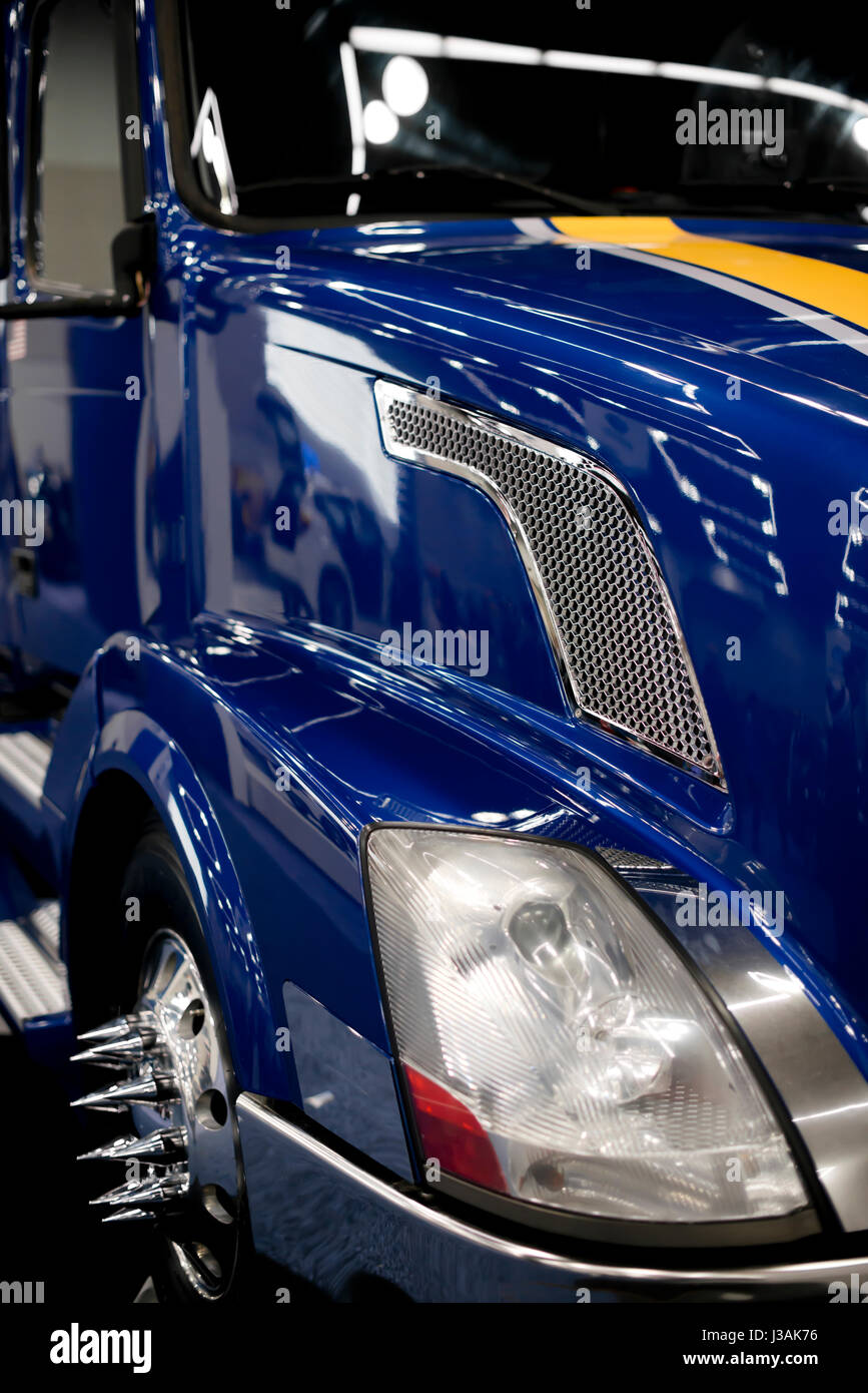A shiny bright blue modern professional cargo rig semi truck with a ...