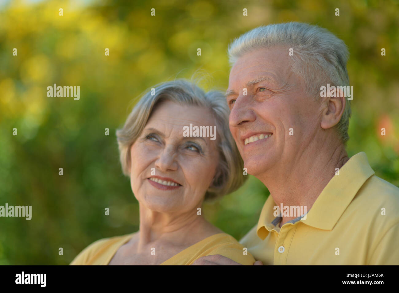 Happy elderly couple embracing Stock Photo - Alamy