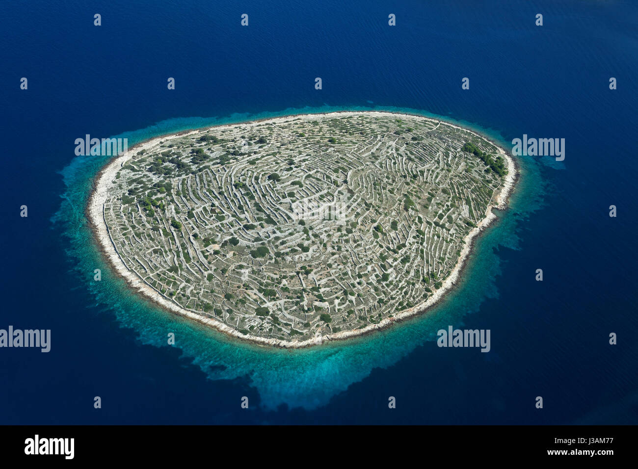 The aerial view of the Baljenac island with ancient dry walls in the ...