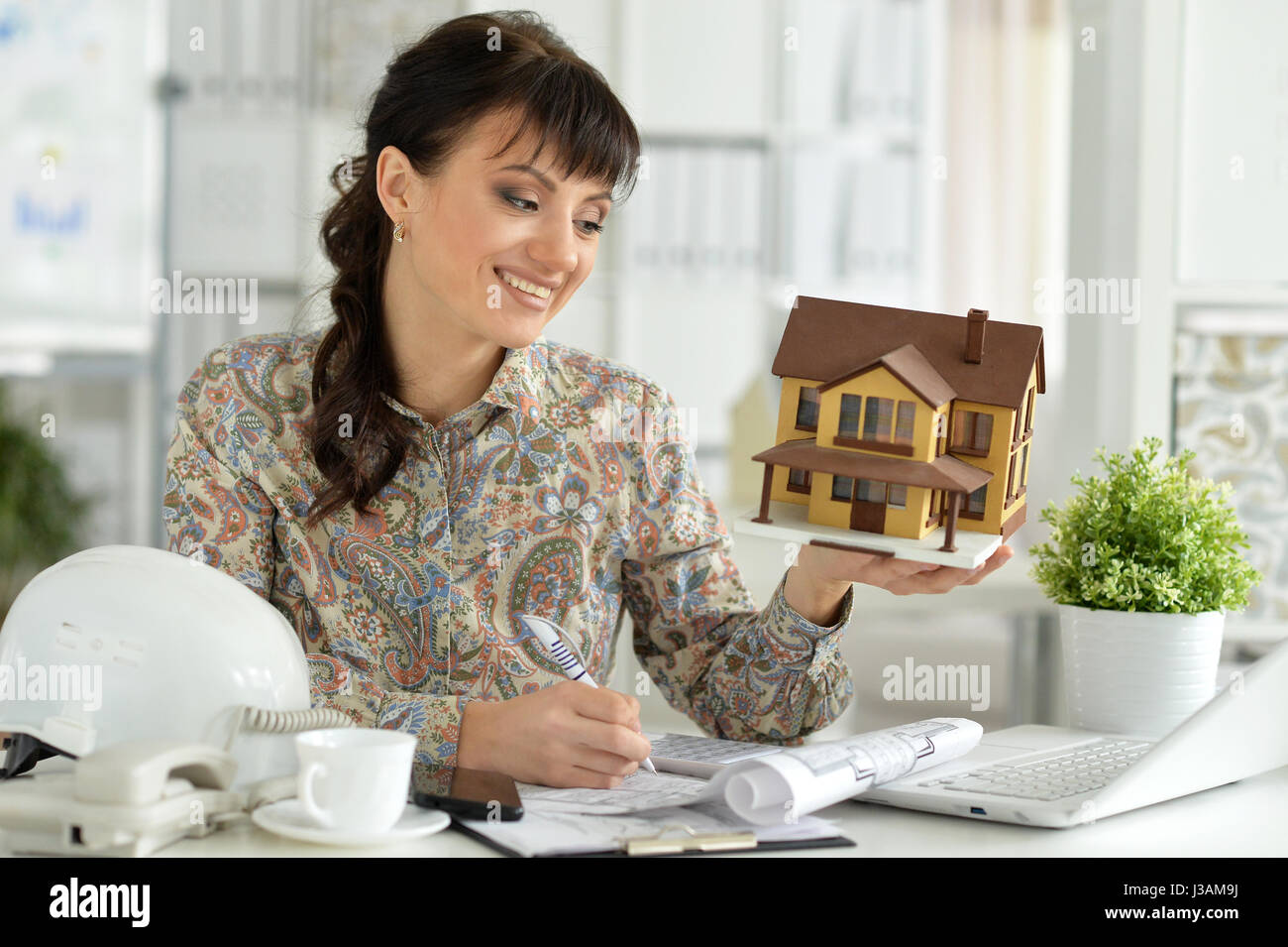 Female architect working Stock Photo - Alamy