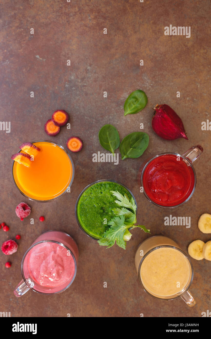 Freshly prepared fruit and vegetable smoothies. Top view, blank space ...