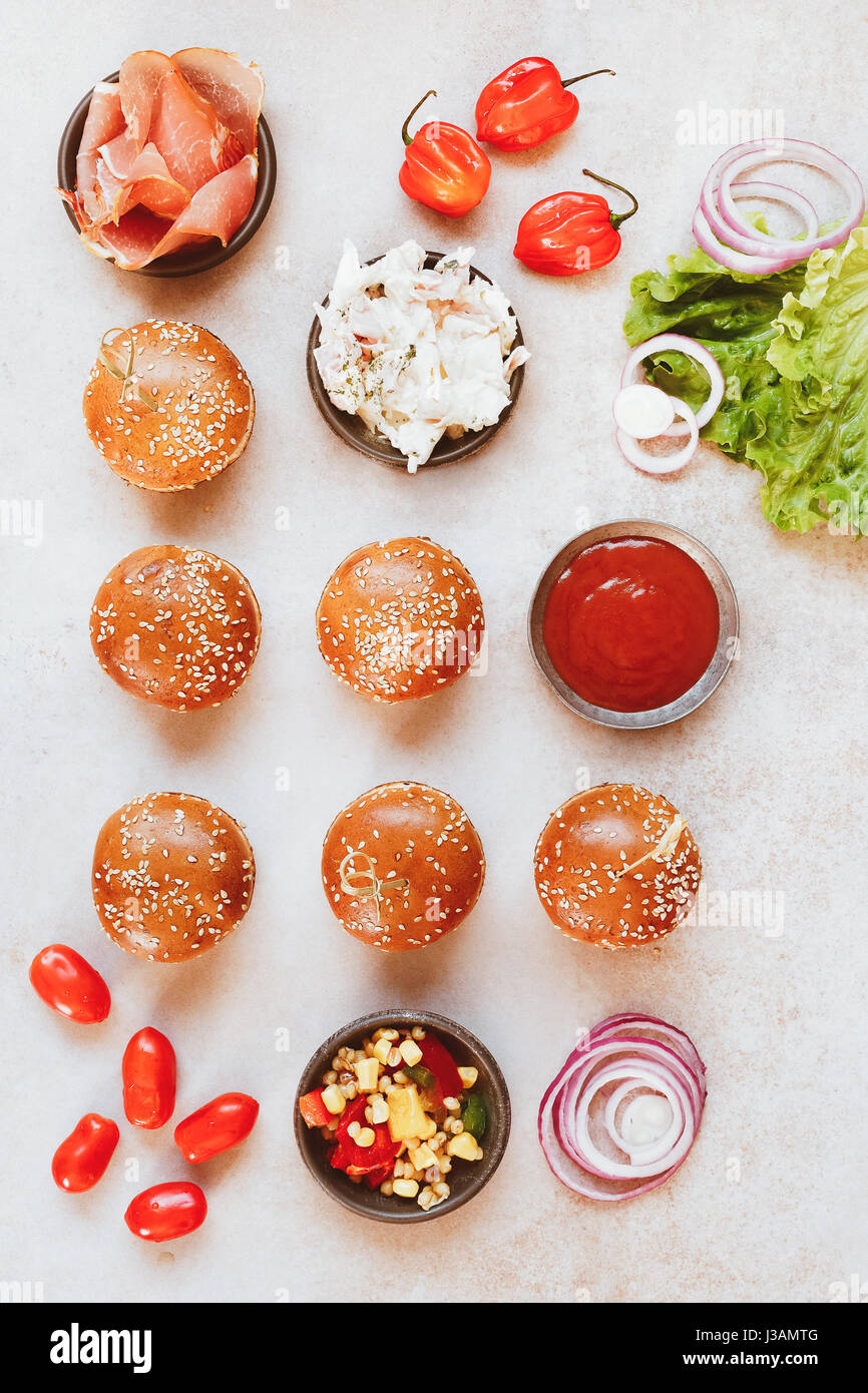 Preparing homemade burgers, various fillings on rustic surface. Top ...