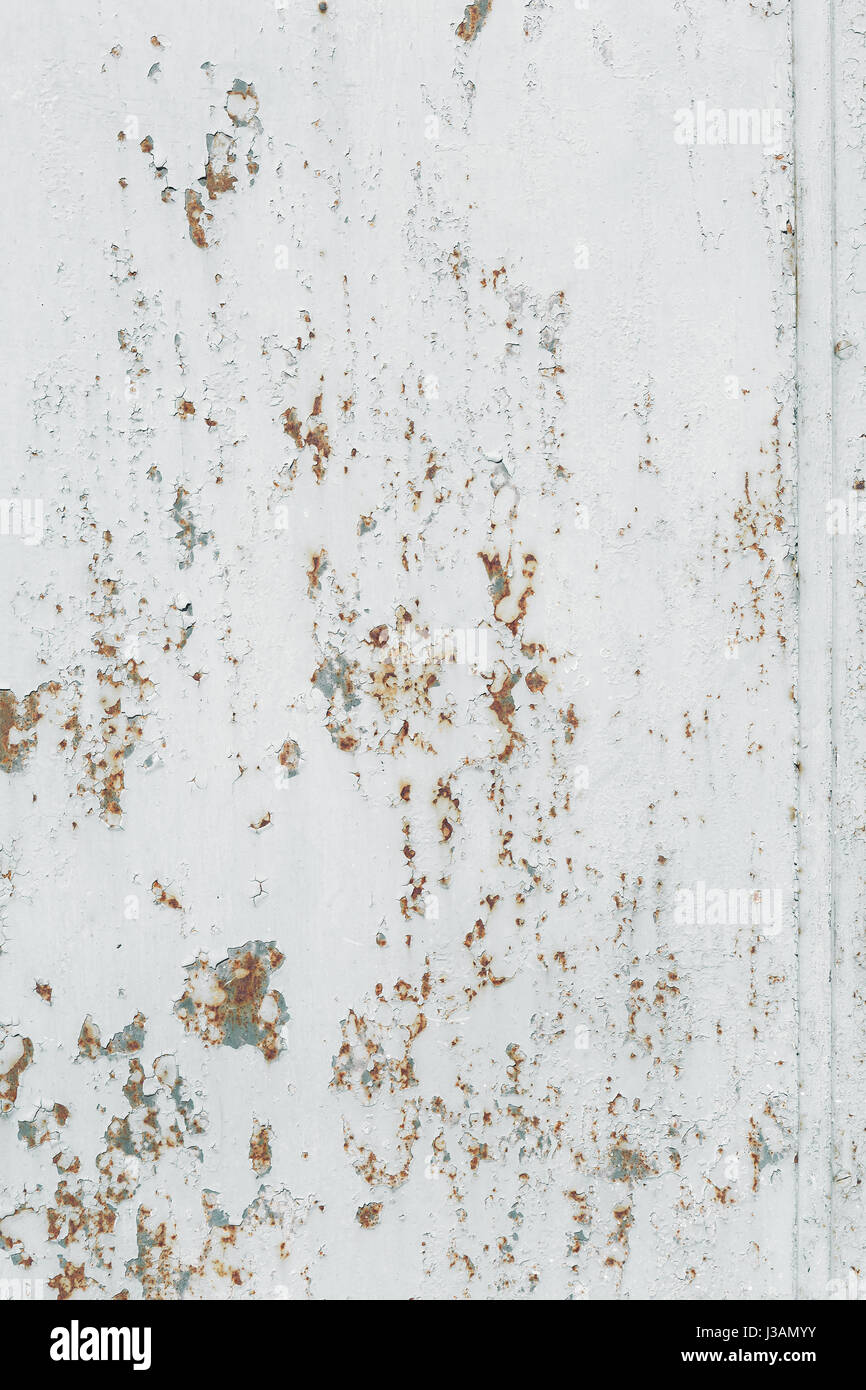 Corrosive white metal surface exposing rusty parts, close up Stock ...