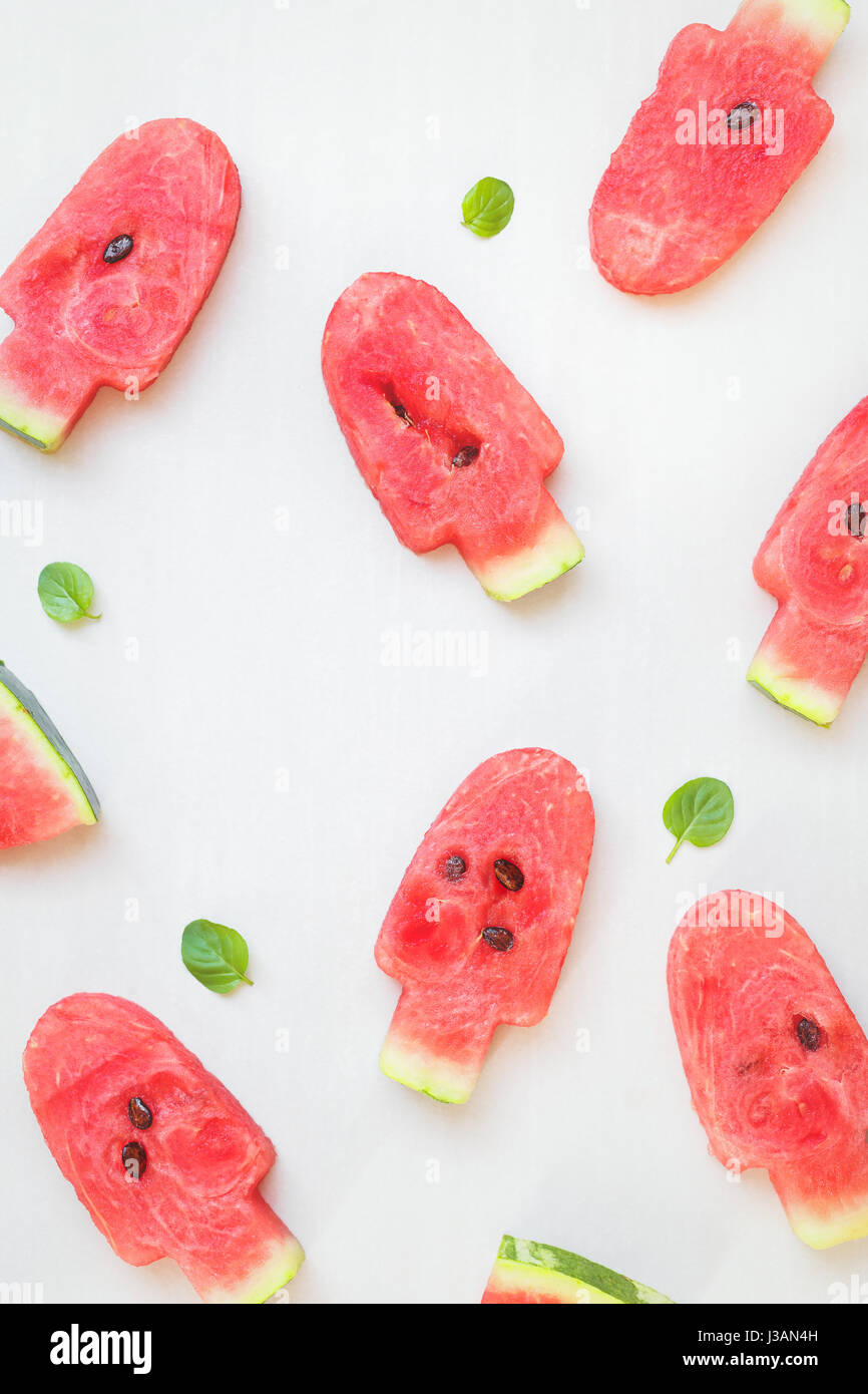 Watermelon shaped ice cream pops, flat lay Stock Photo - Alamy