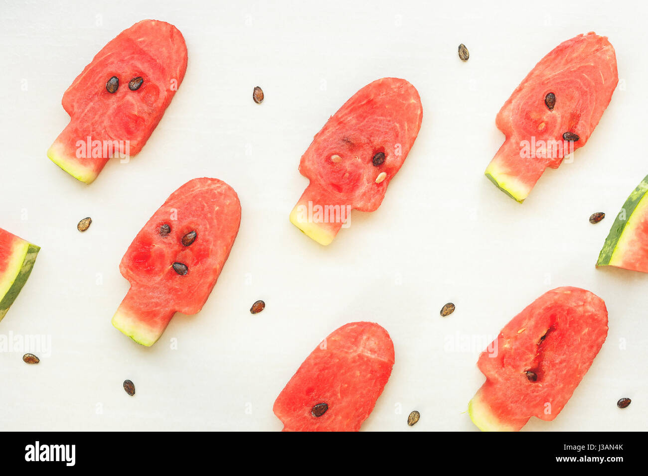 Watermelon shaped ice cream pops, flat lay Stock Photo - Alamy