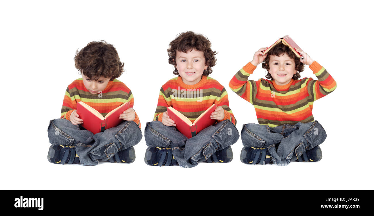 Three equal children reading a red book seated isolated on a white ...