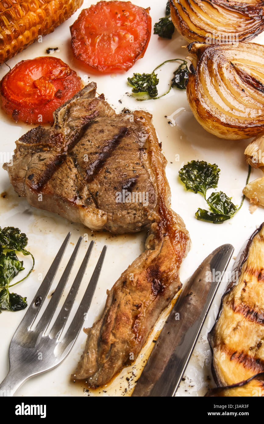 grilled lamb chop with onion, tomato and aubergine Stock Photo - Alamy