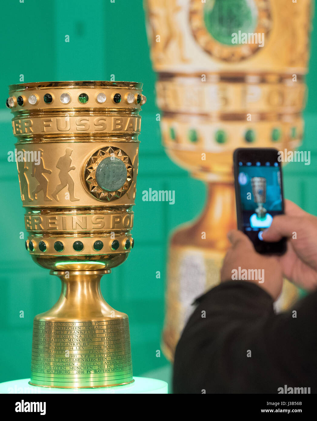 Berlin, Germany. 05th May, 2017. A man takes photos of the DFB Cup ...