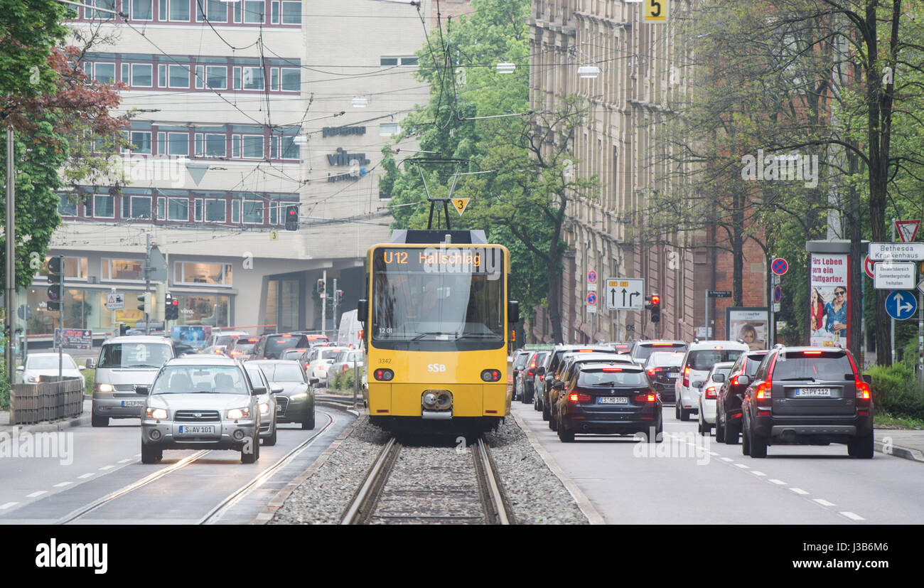 Stuttgart, Germany. 05th May, 2017. Cars drive by a tram operated by ...