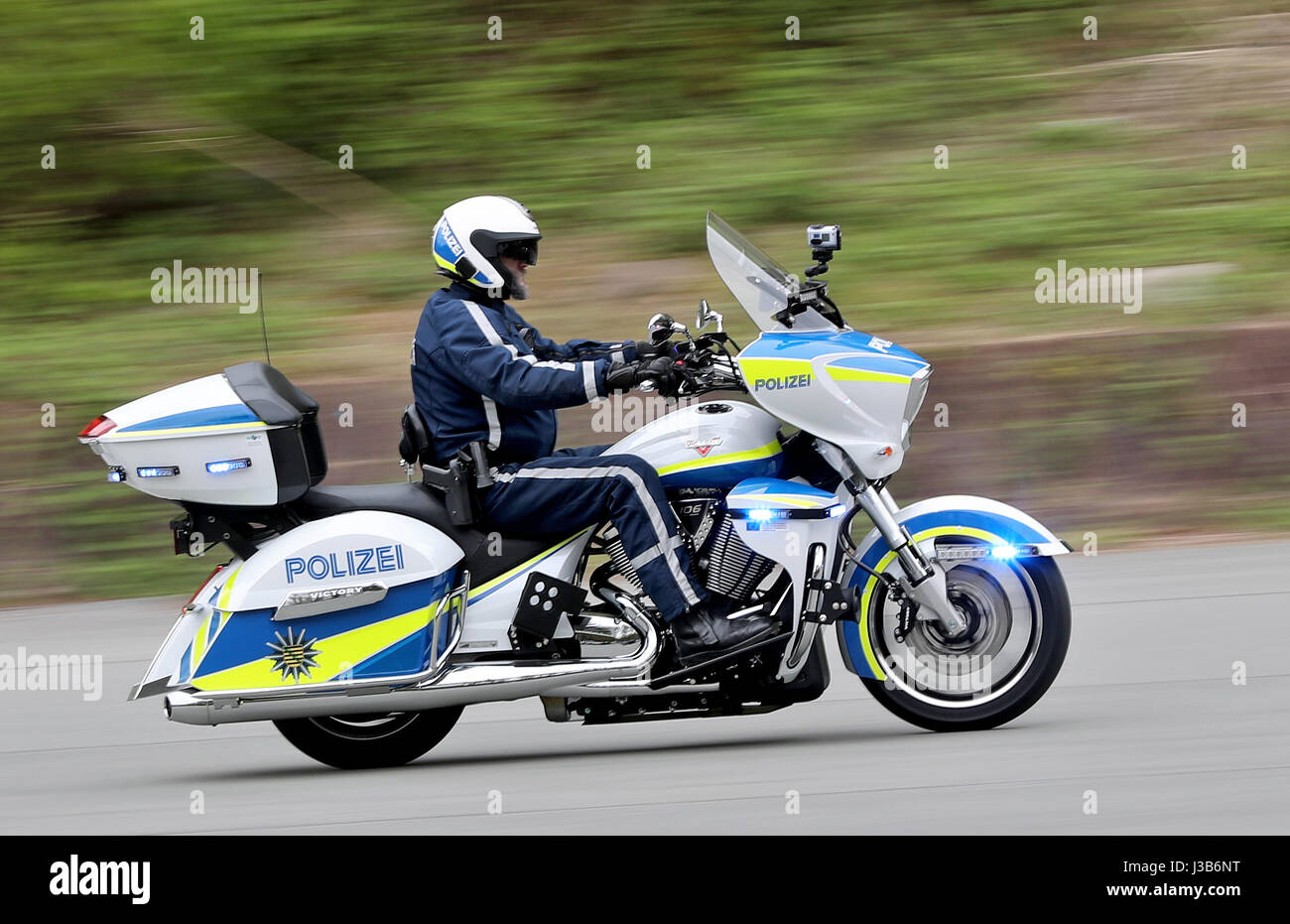 dpatop - A police officer from the Chemnitz police headquarters riding ...
