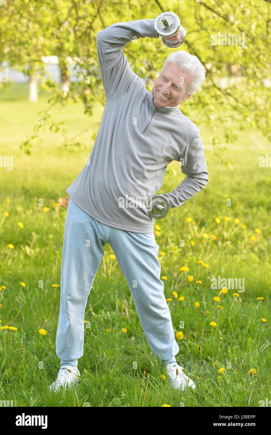 Happy elderly man doing sports Stock Photo - Alamy