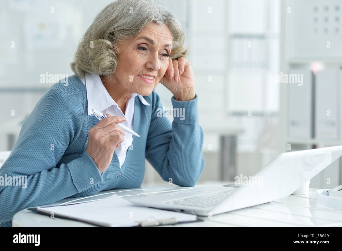 Elderly businesswoman working Stock Photo - Alamy