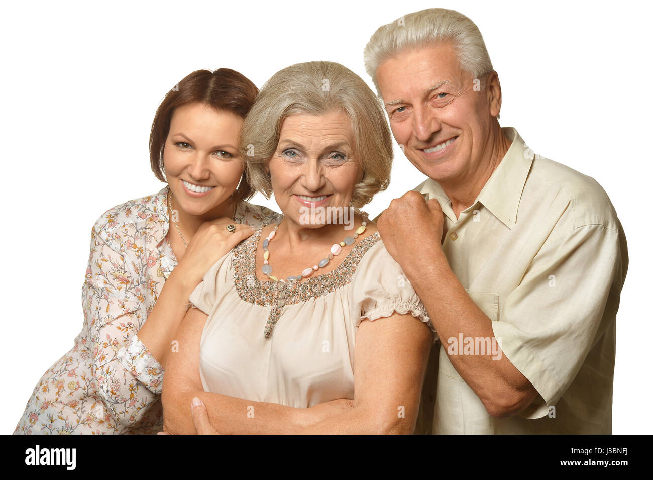 Elderly parents and their adult daughter Stock Photo - Alamy