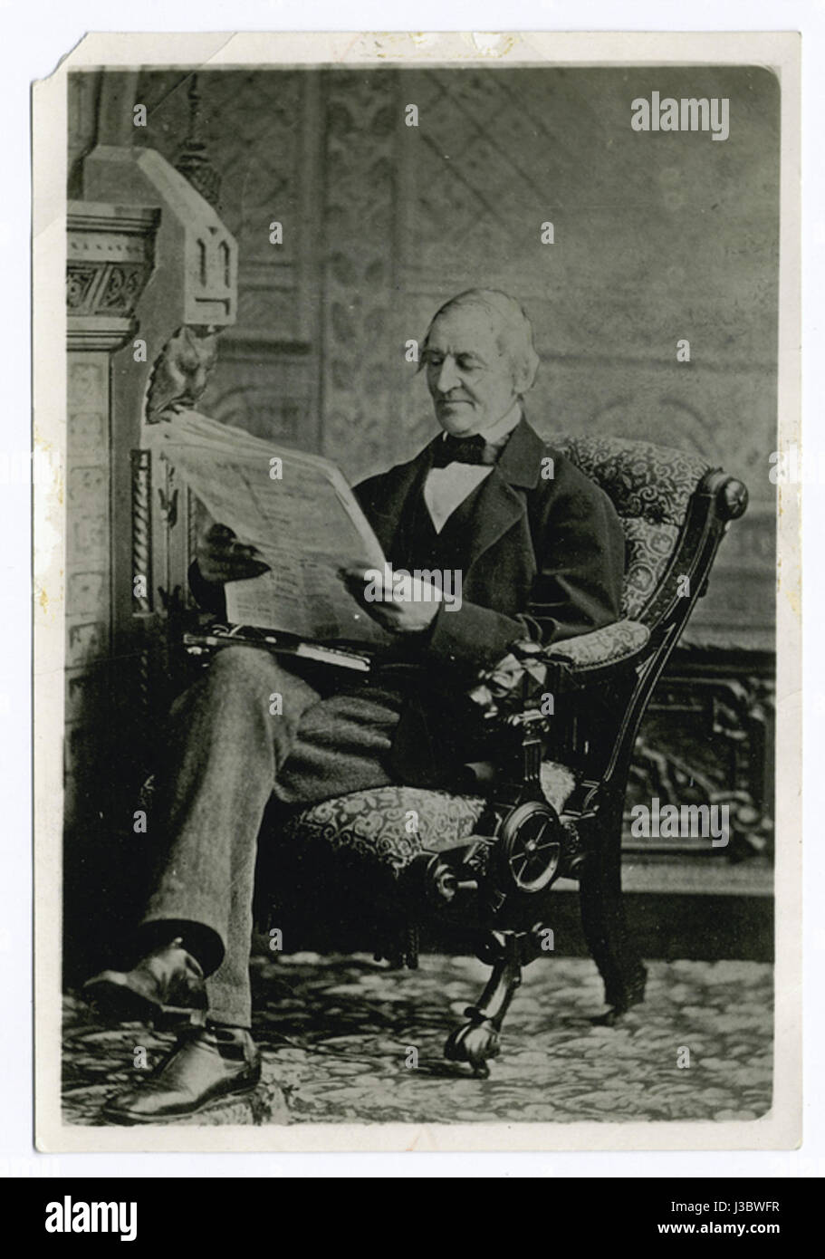 A scene of Emerson, likely Ralph Waldo Emerson, reading a newspaper ...