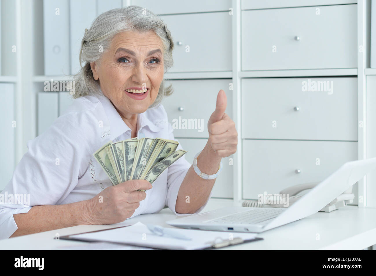 Elderly businesswoman working Stock Photo - Alamy