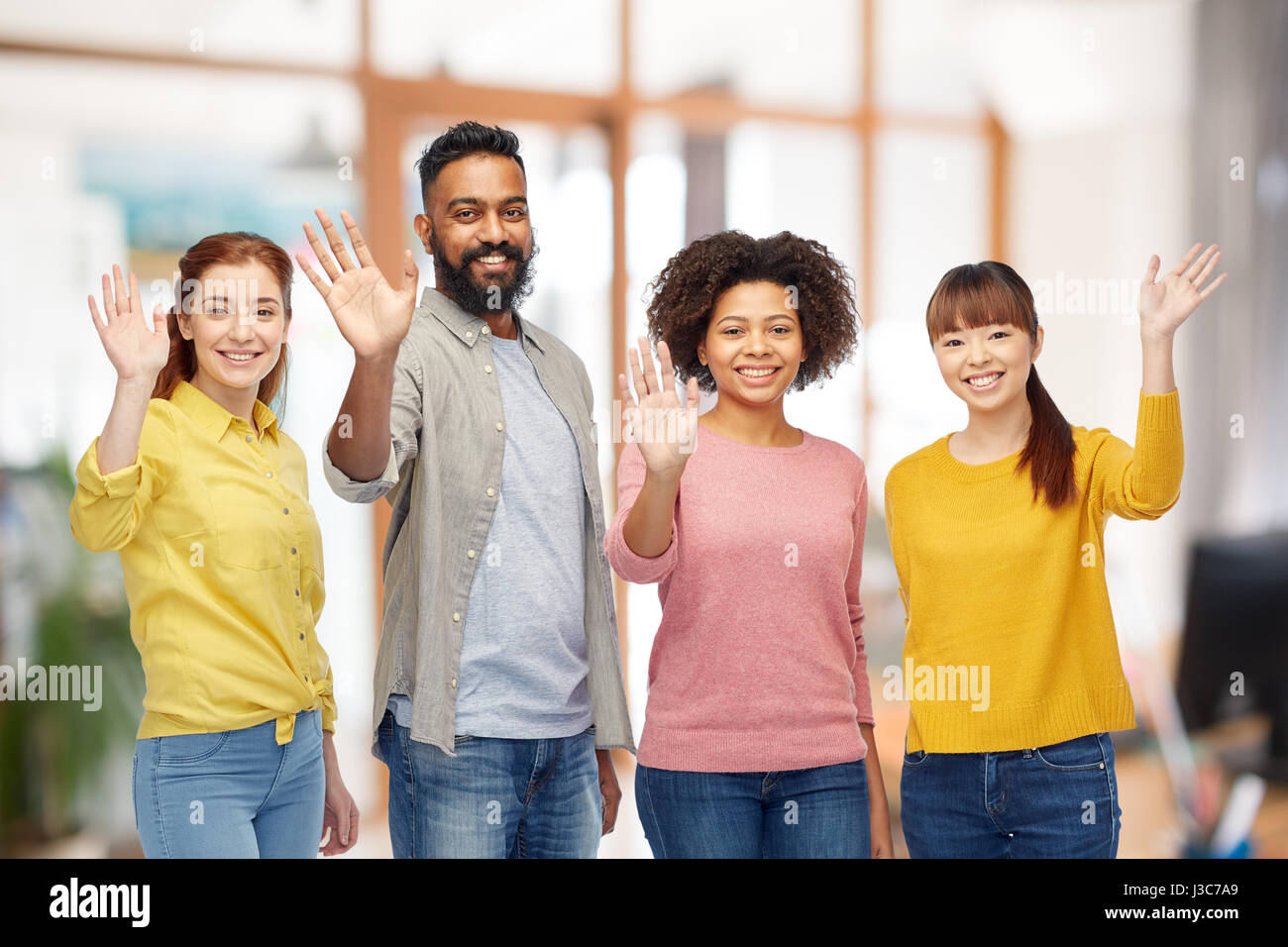 international group of happy people waving hands Stock Photo - Alamy