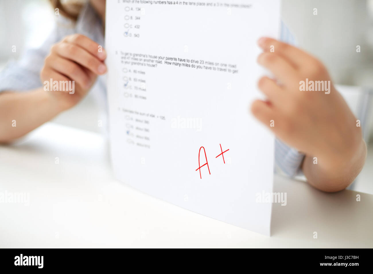 girl with test paper at school Stock Photo - Alamy