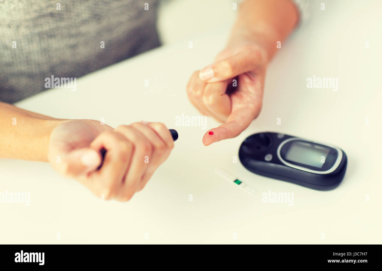 Glucometer test finger hi-res stock photography and images - Alamy