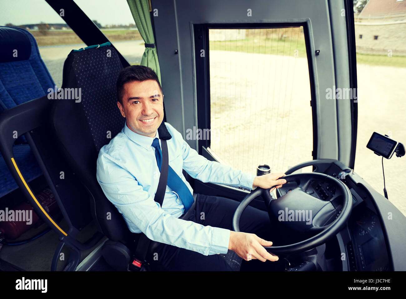 happy driver driving intercity bus Stock Photo - Alamy