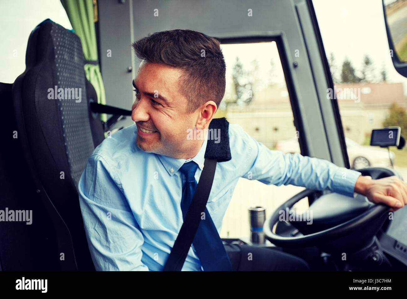 happy driver driving intercity bus Stock Photo - Alamy