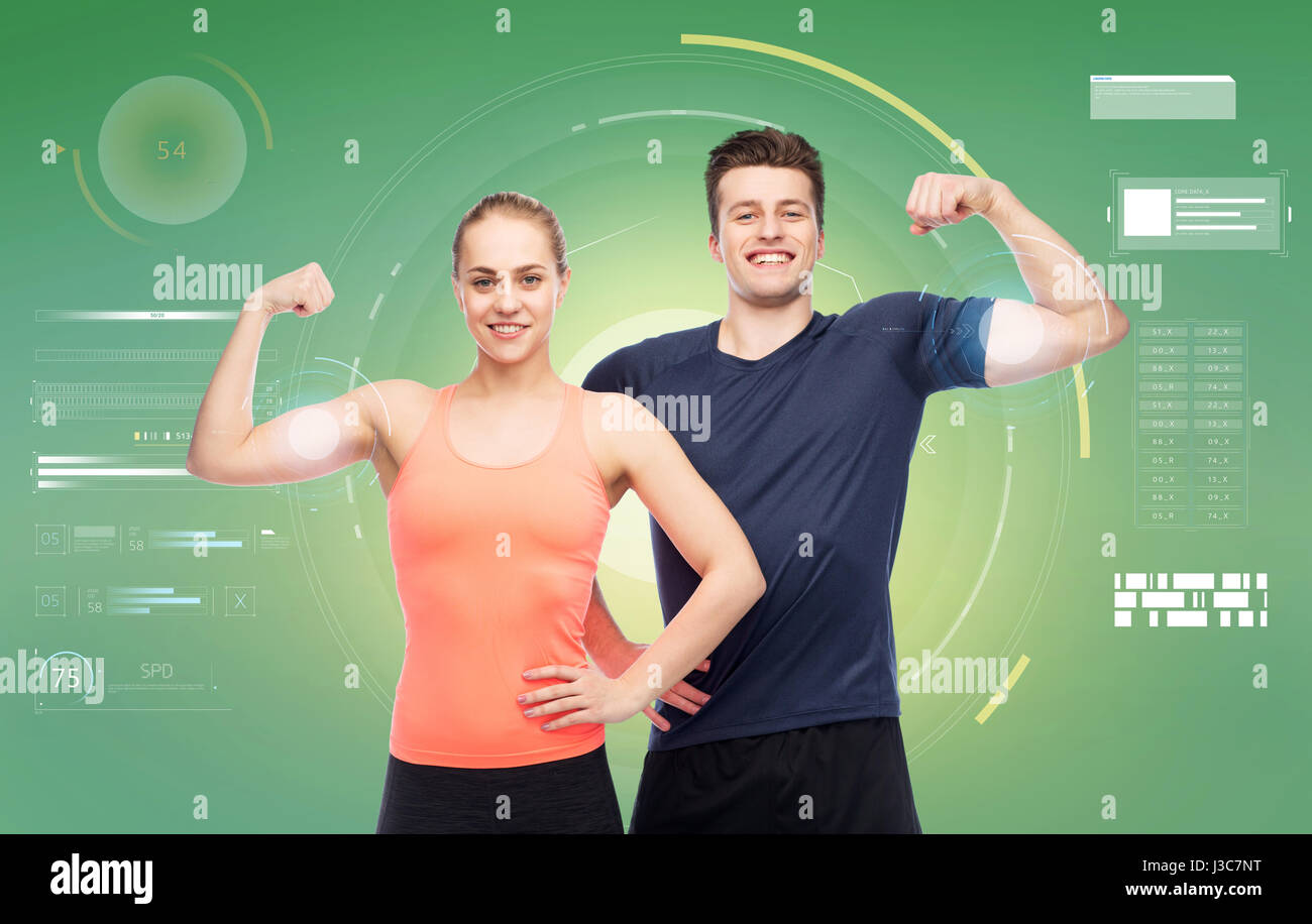 happy sportive man and woman showing biceps power Stock Photo - Alamy