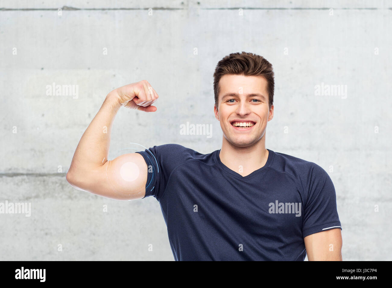 sportive man showing bicep power Stock Photo - Alamy