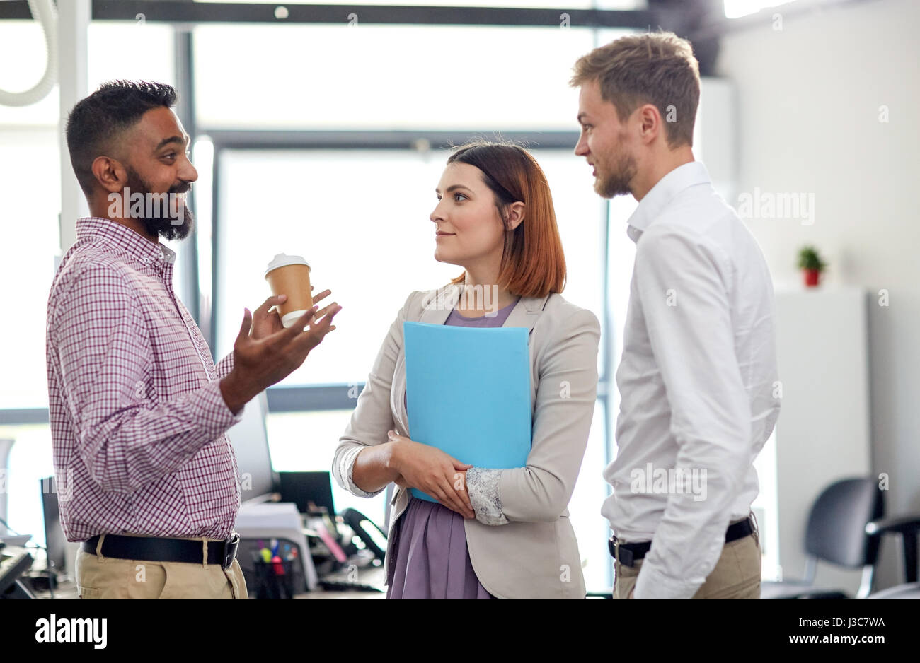 happy business team drinking coffee at office Stock Photo - Alamy