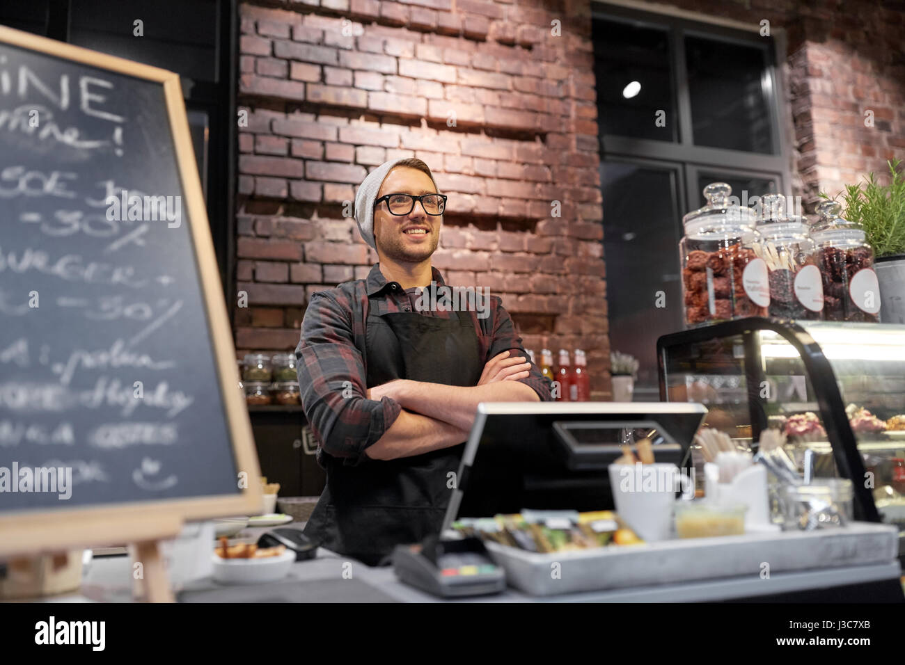 happy seller man or barman at cafe counter Stock Photo - Alamy