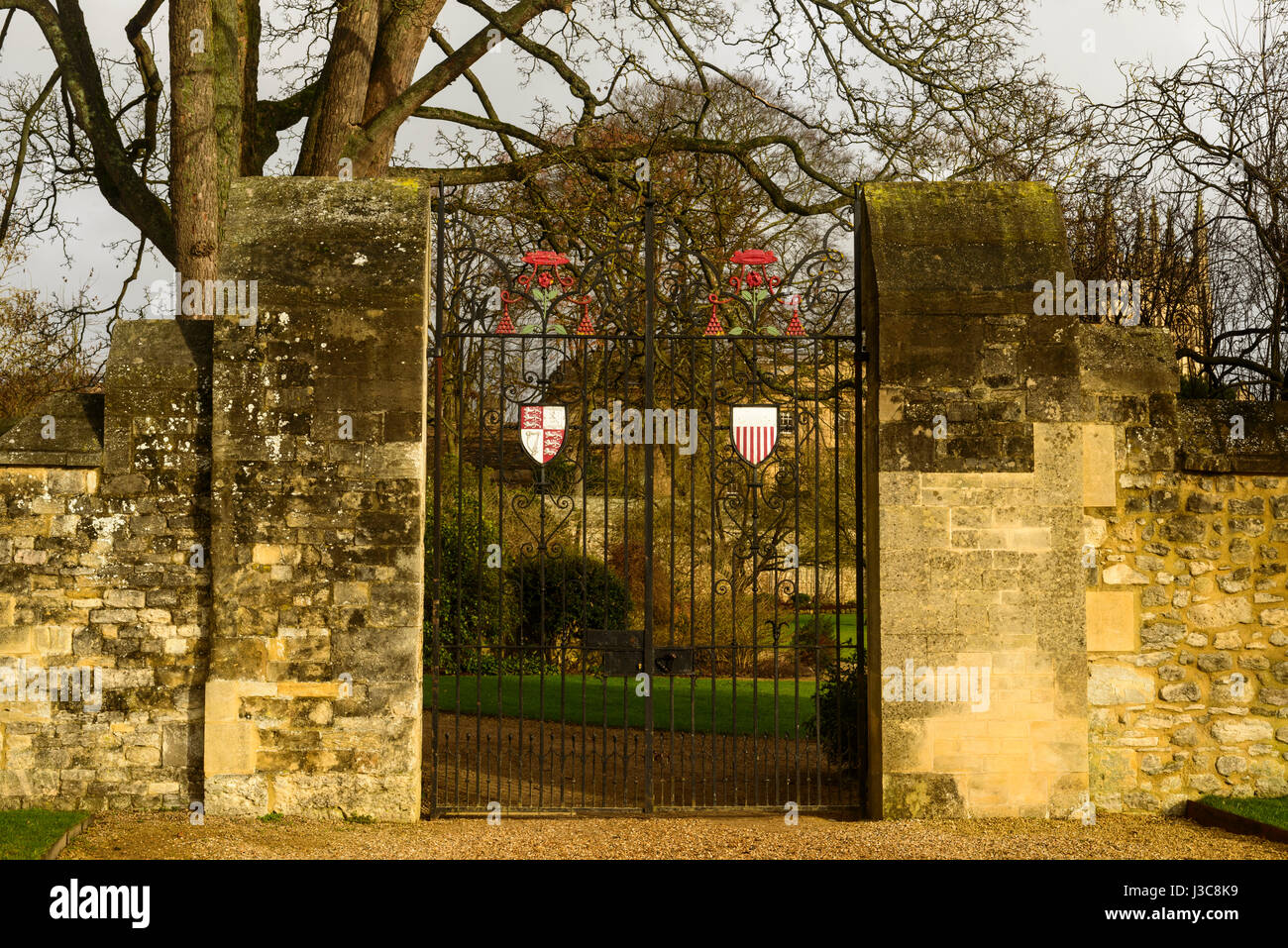 Gate set in stone wall Stock Photo - Alamy