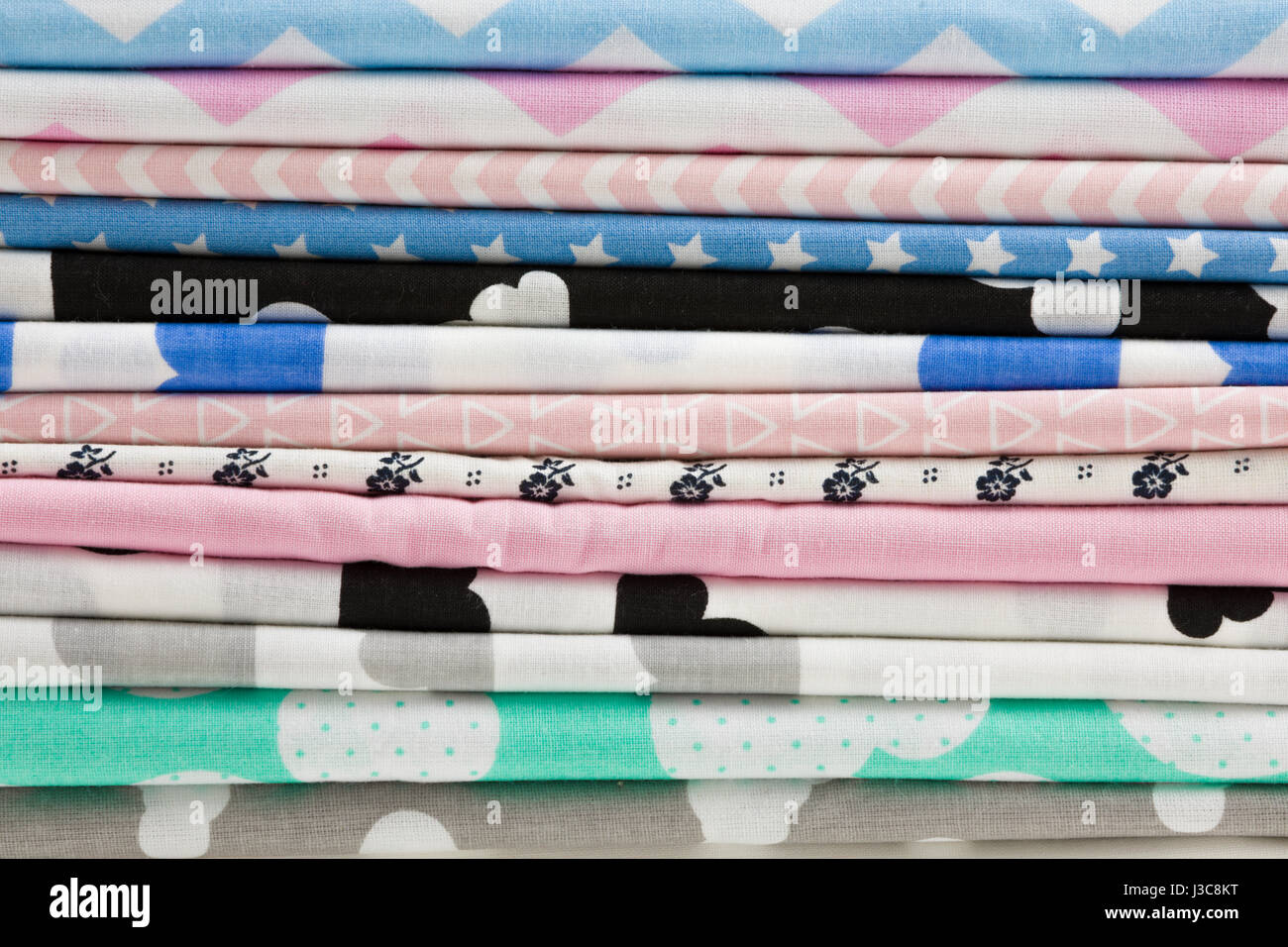 Stack of 100% cotton fabric material for tailor or homework background ...