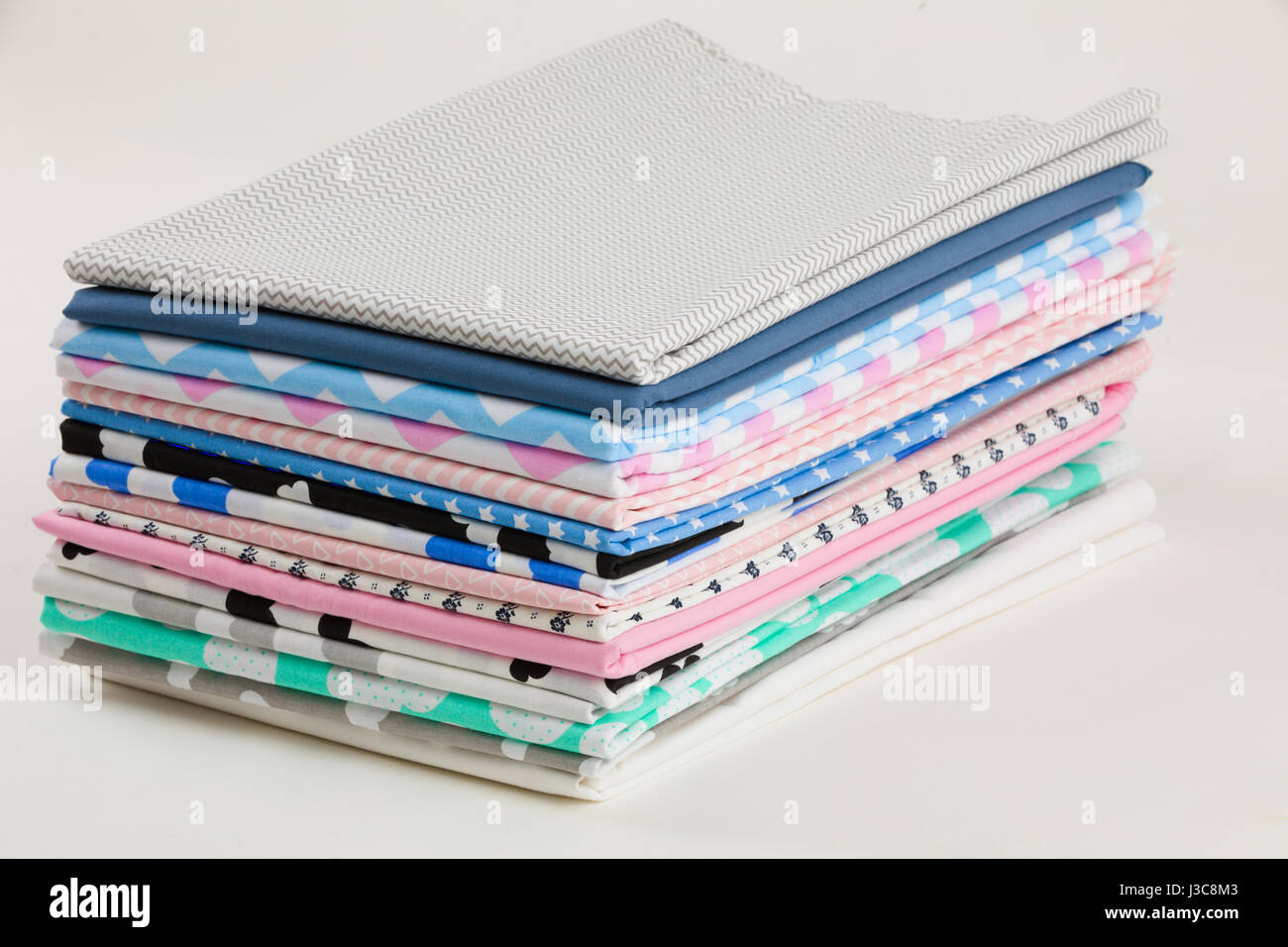 Stack of cotton fabric material for tailor DIY homework Stock Photo - Alamy
