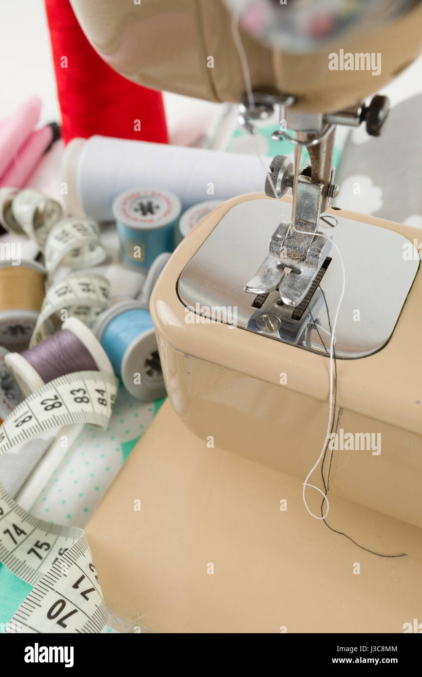 detail of Sewing machine, cotton cotton fabric and tailor measurement ...