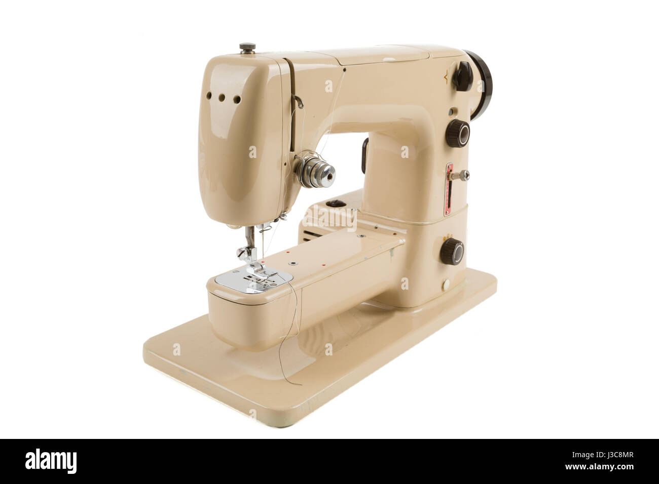Old vintage beige sewing machine isolated on white background Stock ...