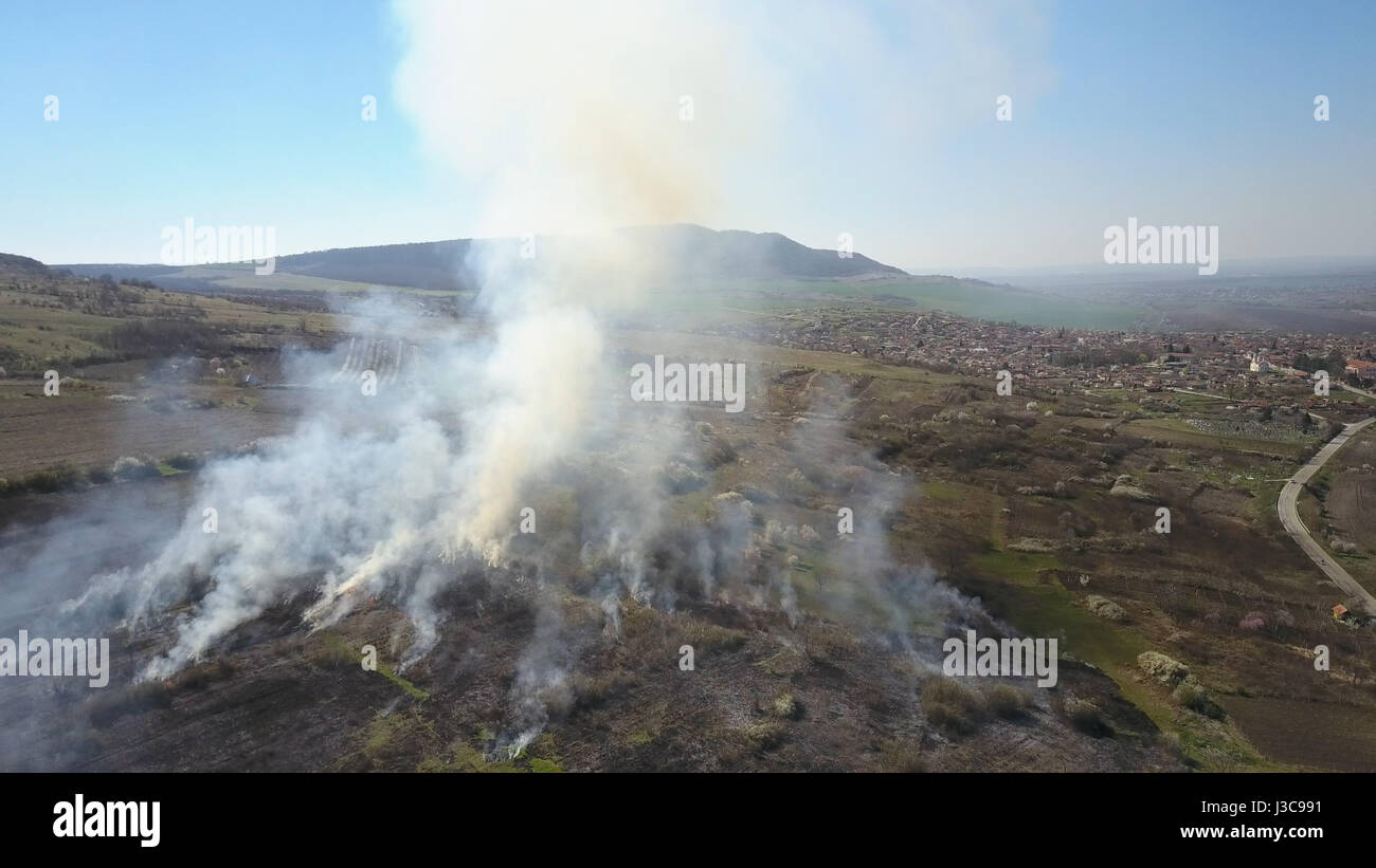 Fire burns in the forest above a village of Bozveliisko, some 60 km ...