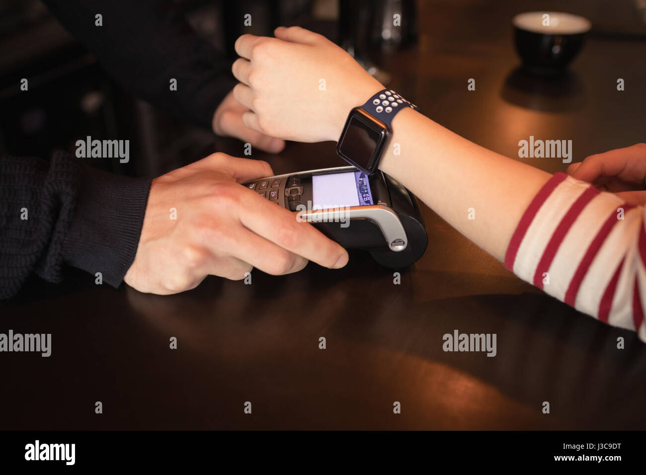 Contactless payment using smartwatch hi-res stock photography and ...