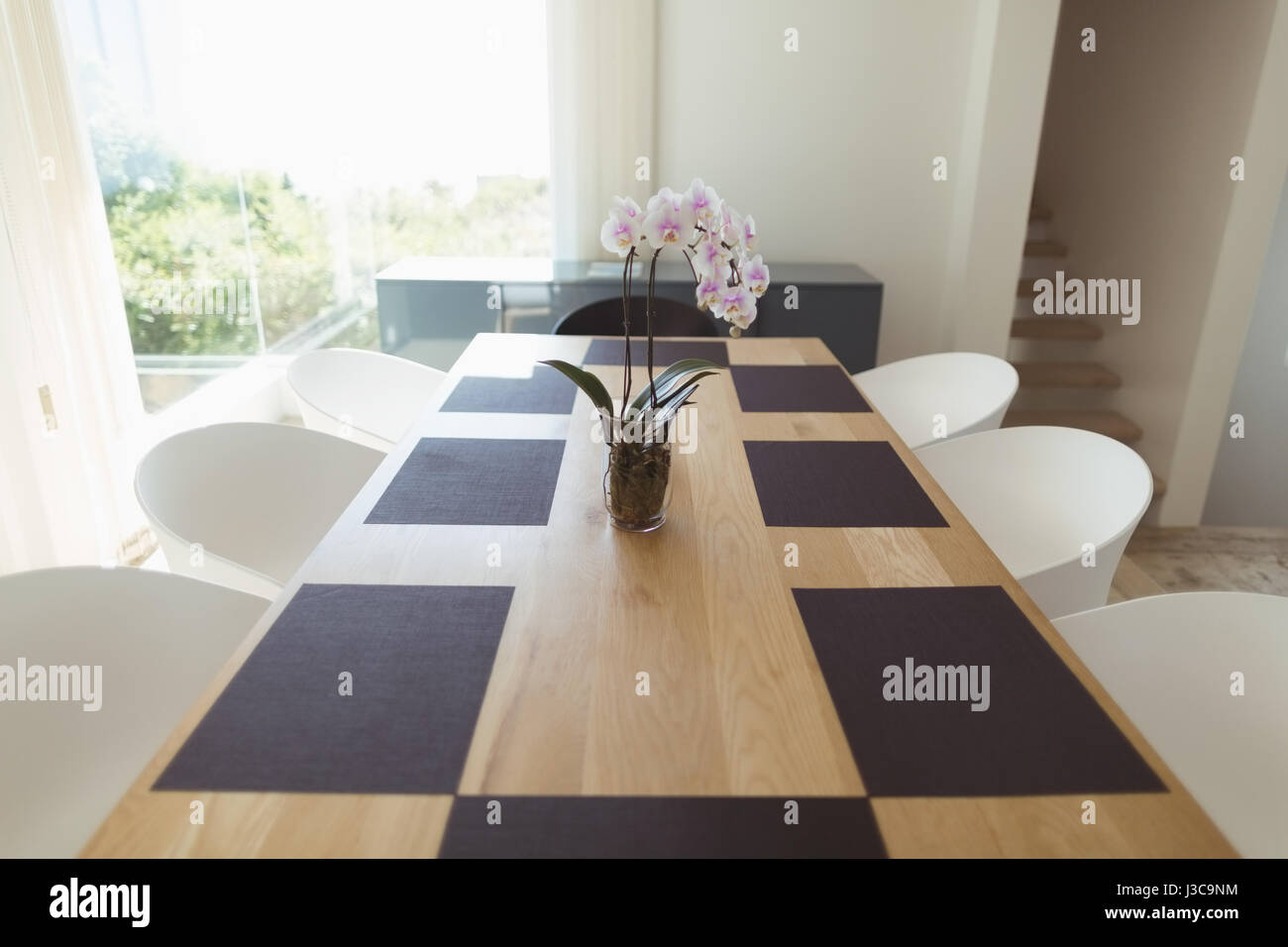 View of a modern dining table at home Stock Photo - Alamy