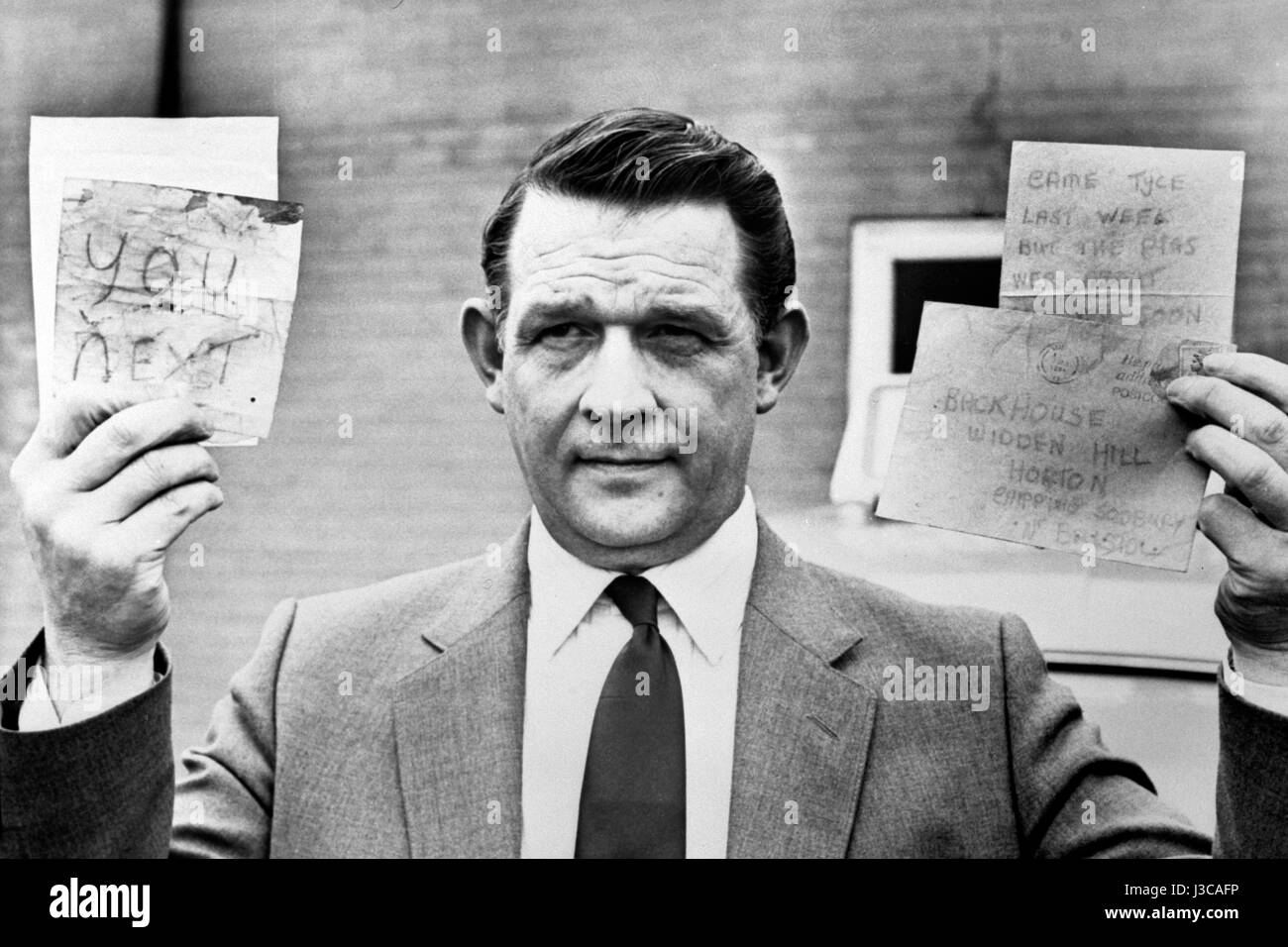 Chief Inspector Peter Brock with the death note and letter used as ...